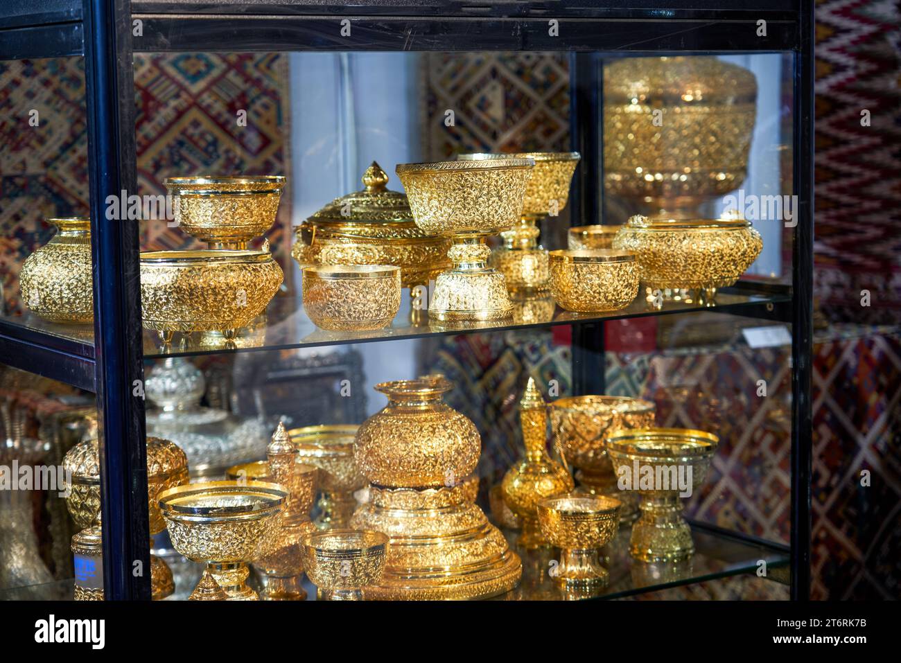 Southeast Asian style gold containers and utensils placed in the ...