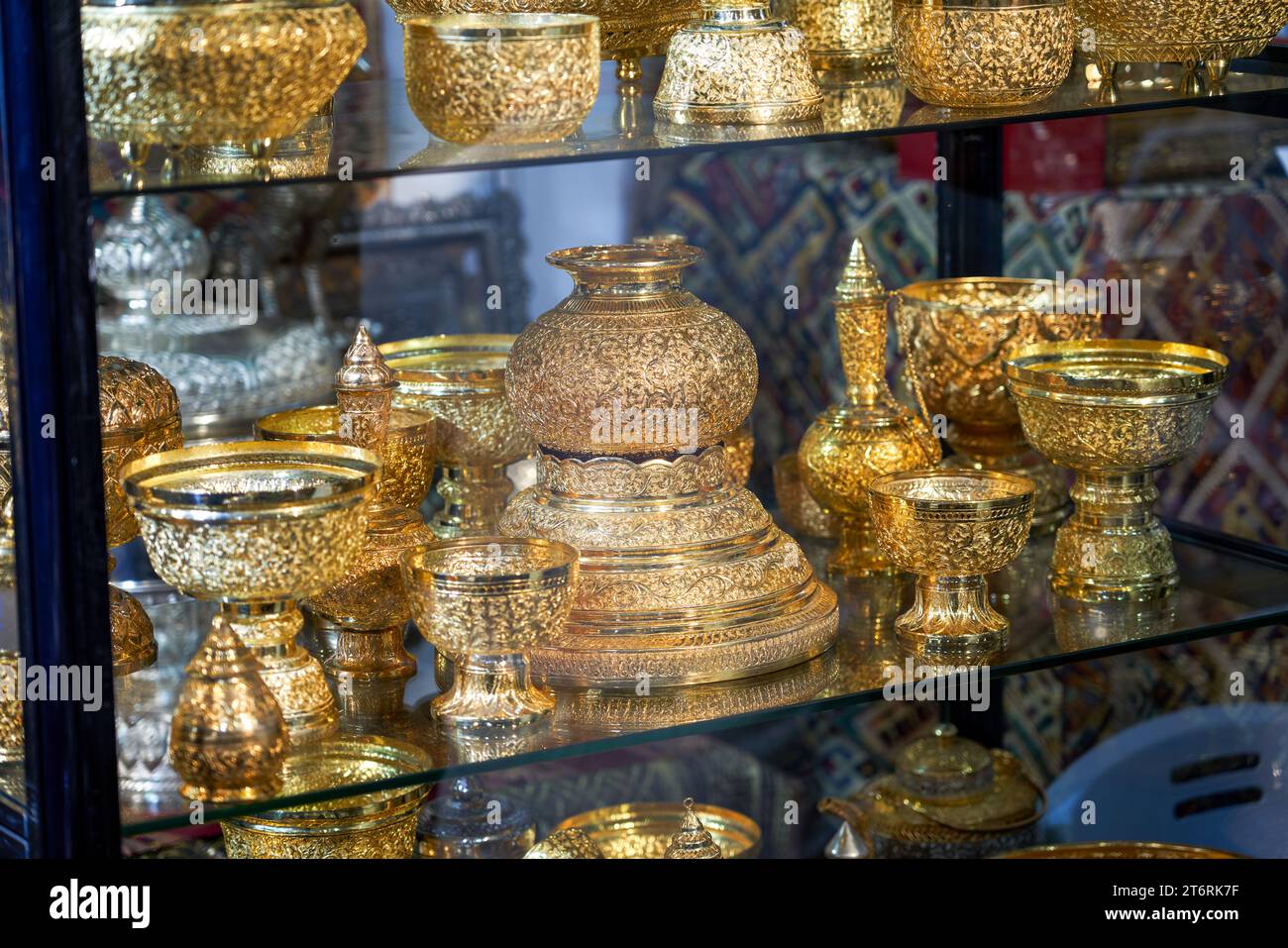 Southeast Asian style gold containers and utensils placed in the ...