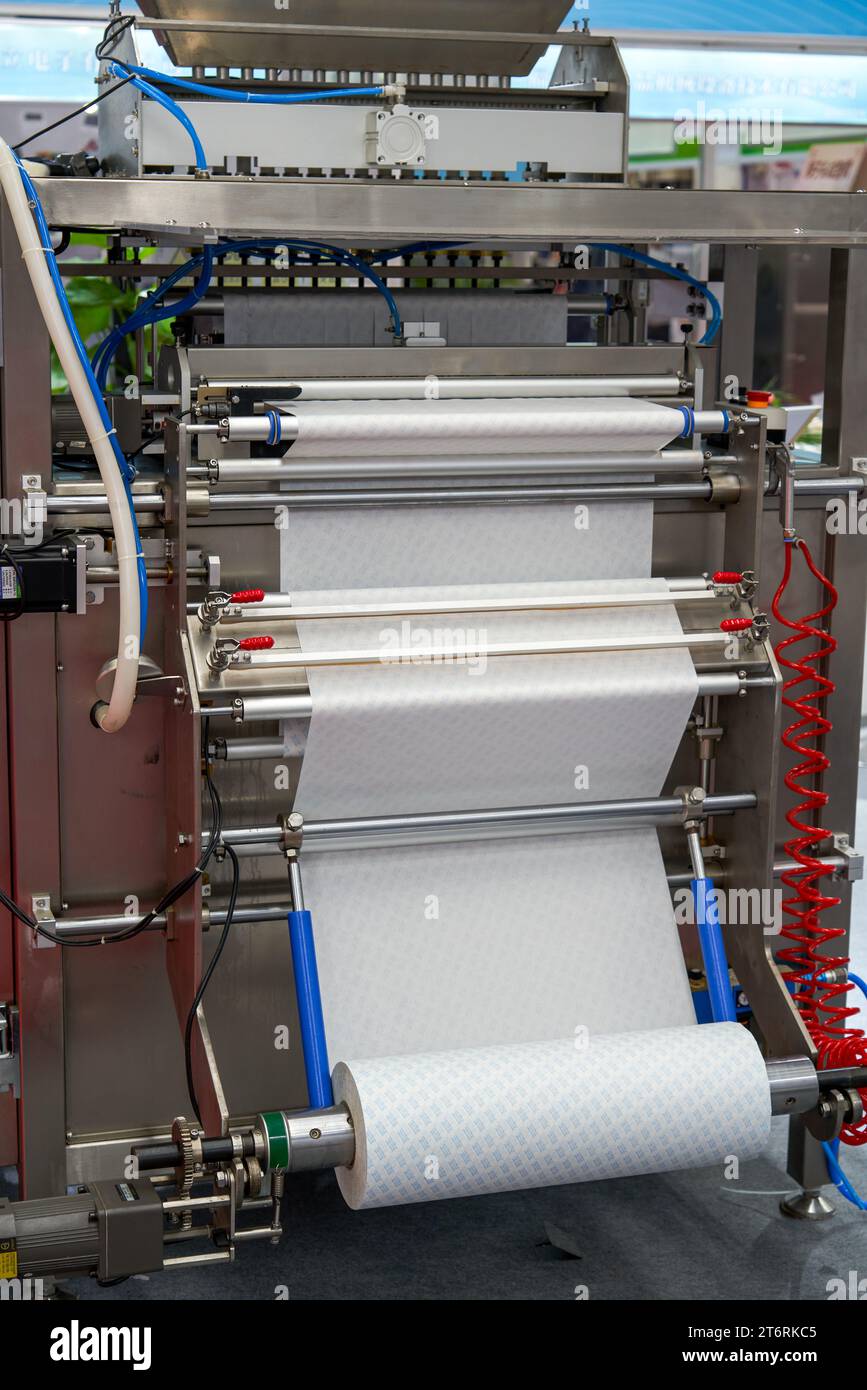 Packaging machine assembly line equipment in food factory Stock Photo ...