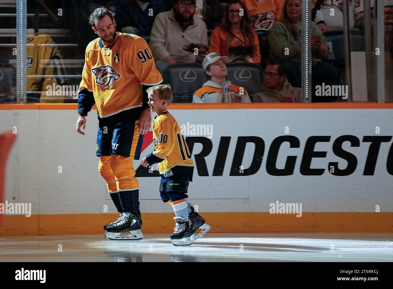 Nashville Predators center Ryan O'Reilly (90) skates with his son ...