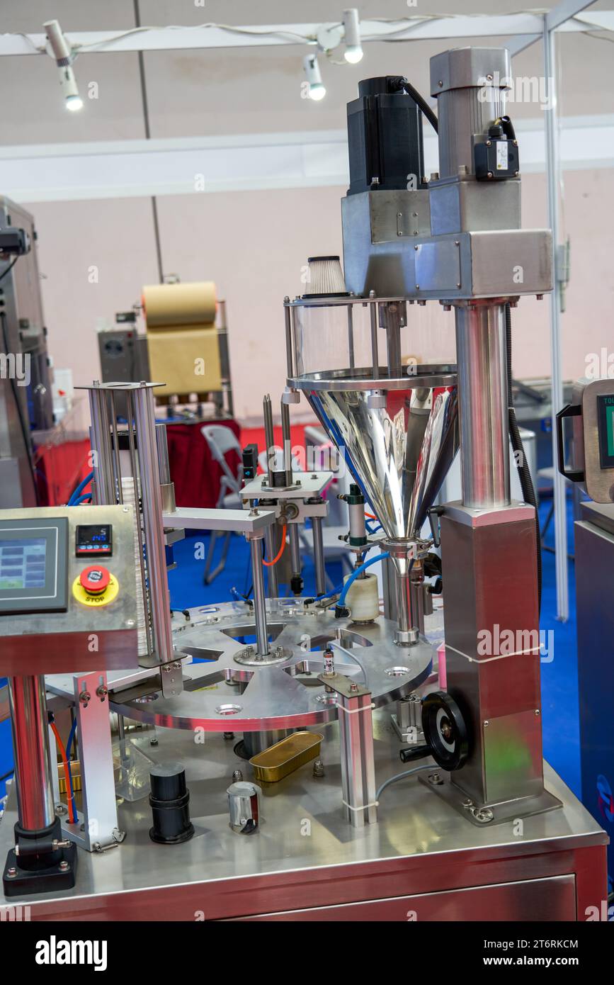 Packaging machine assembly line equipment in food factory Stock Photo ...