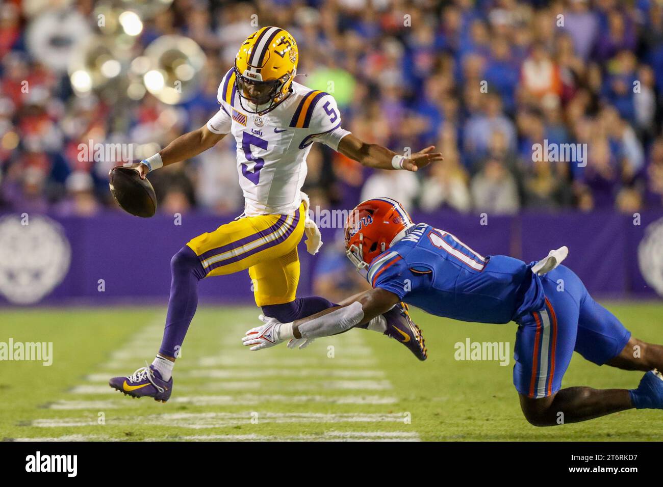 November 11, 2023: LSU quarterback Jayden Daniels (5) avoids a tackle ...