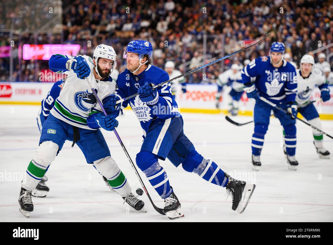 Toronto Maple Leafs defenseman Jake McCabe (22) checks Vancouver ...