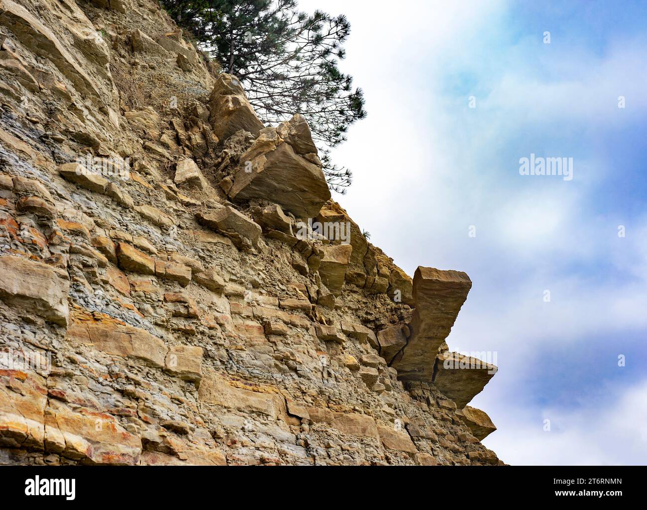 Exposed rock with high risk of falling down Stock Photo - Alamy