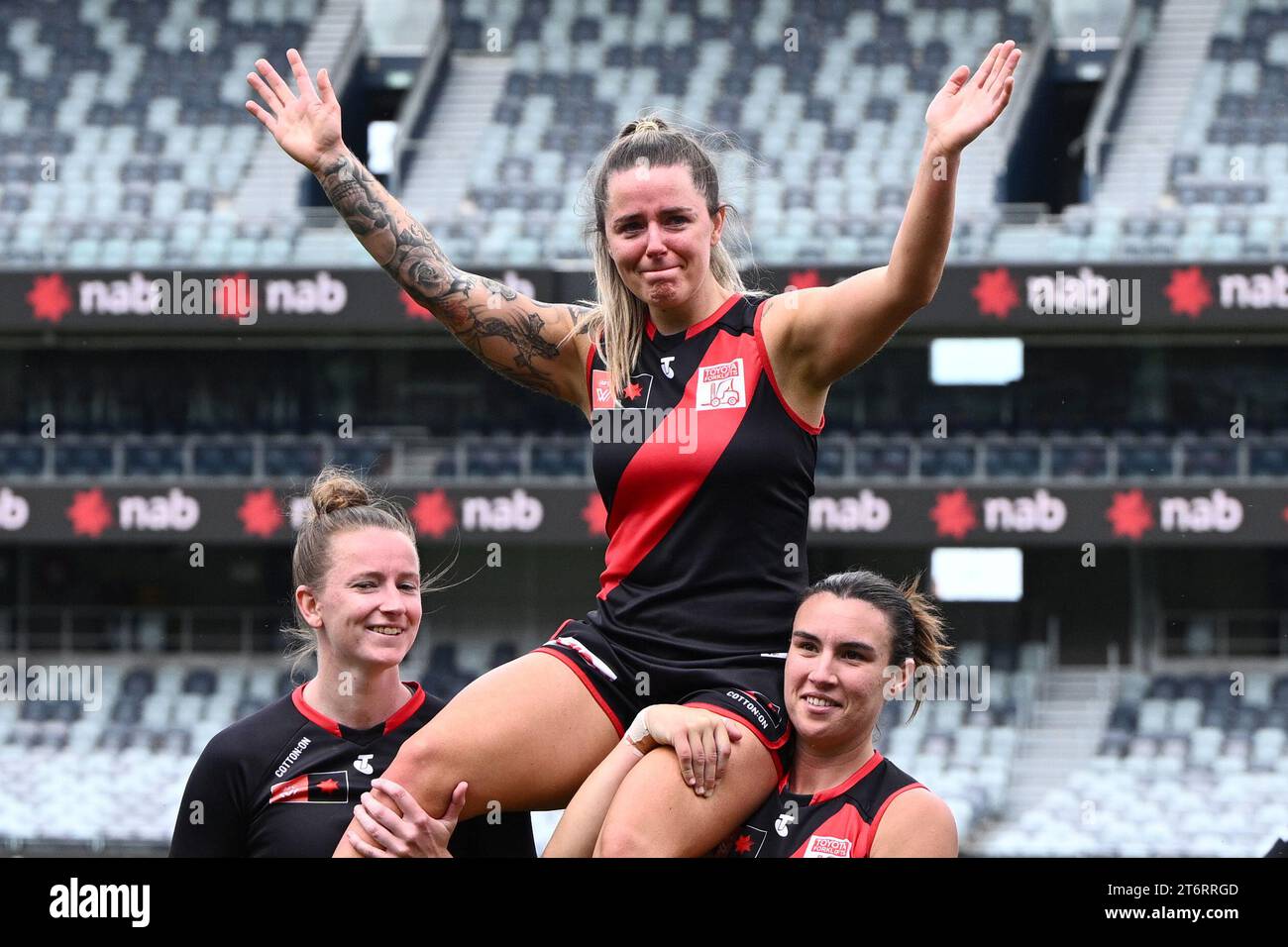 Jessica Wuetschner of Essendon is chaired off to mark her final game ...