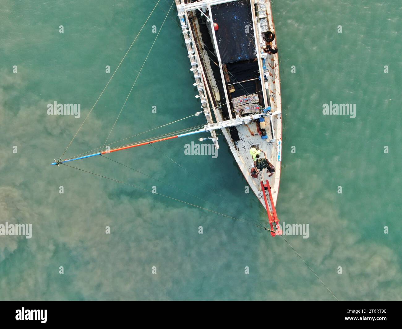 Fishing boats moored in the shallow waters at Sumur Pandeglang of ...
