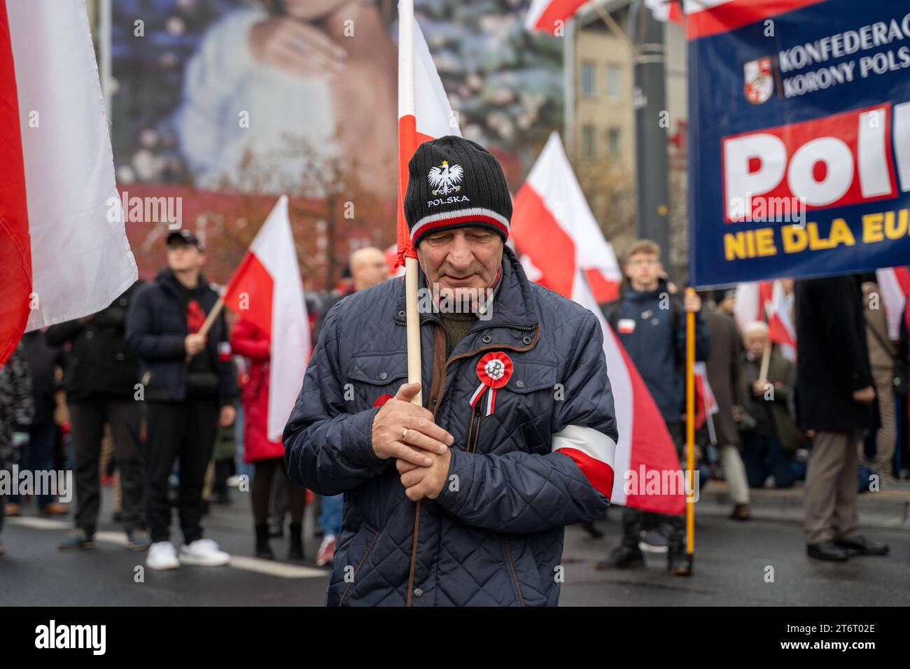 A man kneels during the rosary before the Independence March, taking ...