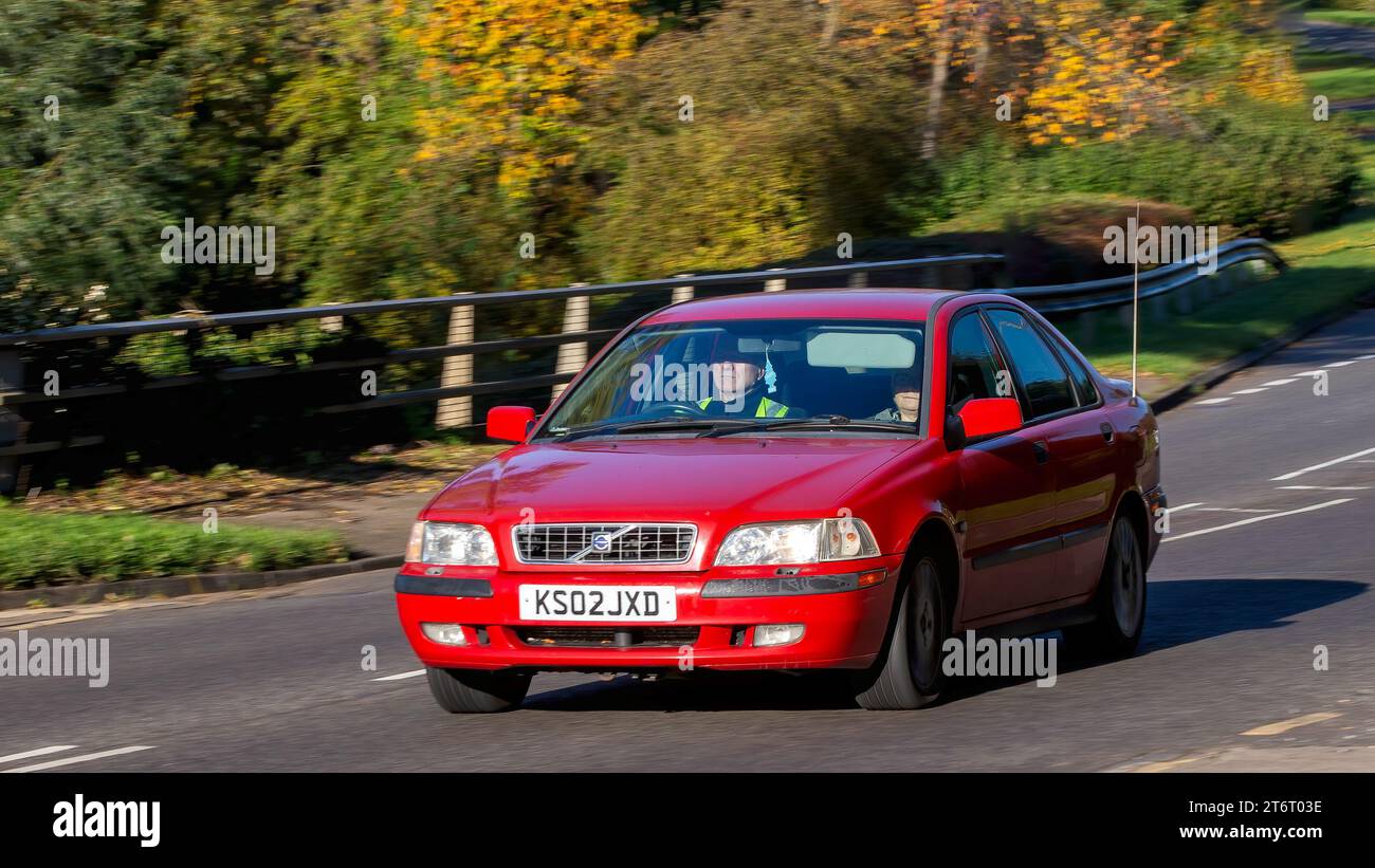 Milton Keynes,UK - Nov 11th 2023: 2002 red Volvo S40 car driving on an ...