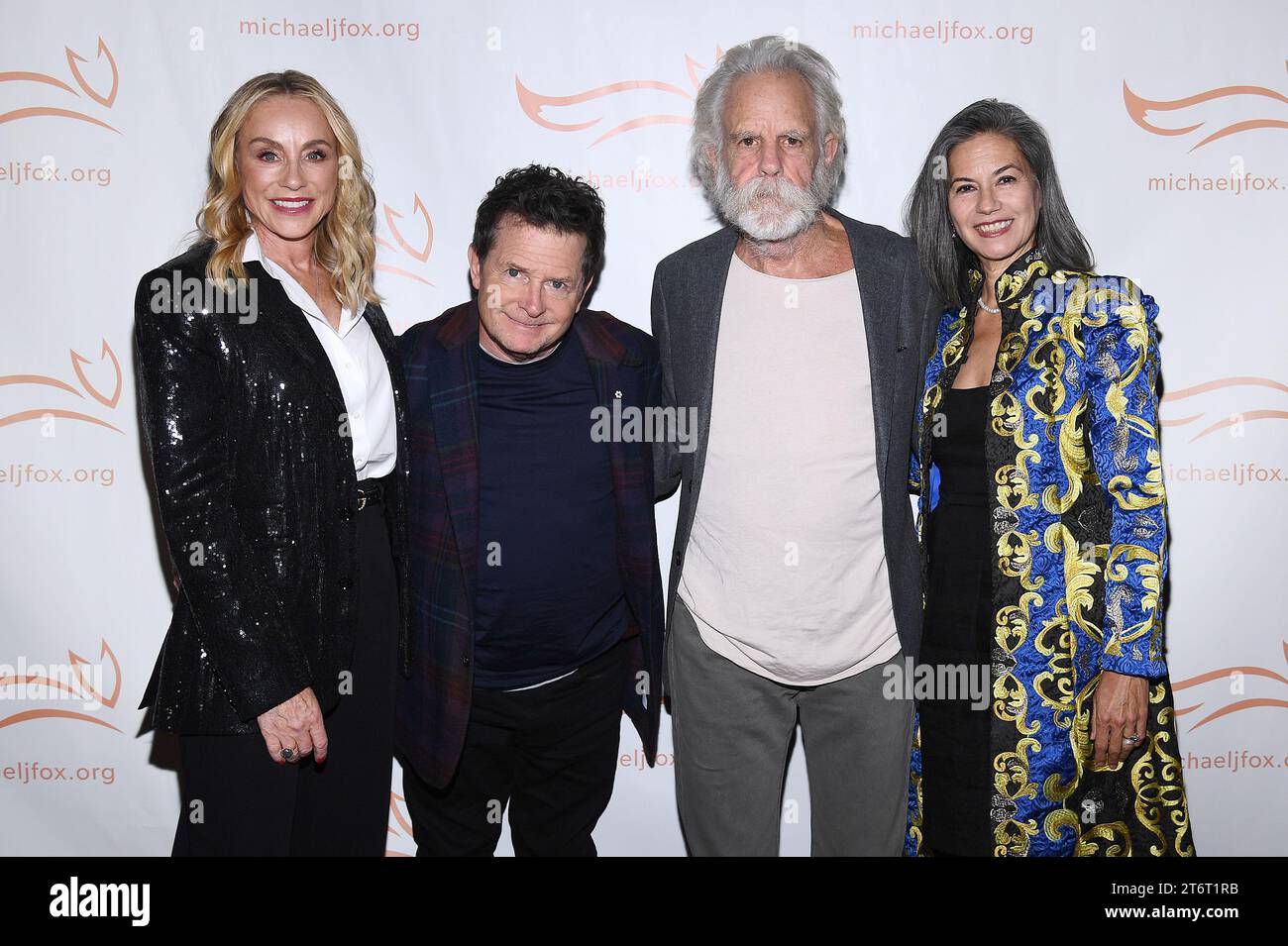 (L-R) Tracy Pollan, Michael J. Fox, Bob Weir and Natascha Muenter Weir ...