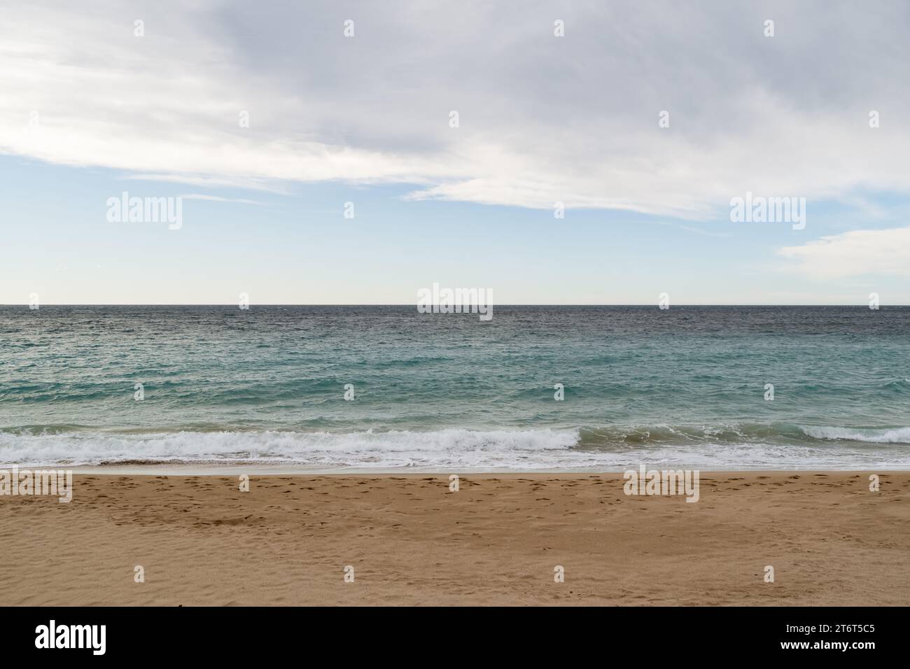 Empty sand beach on Mediterranean sea with horizon line vacation ...