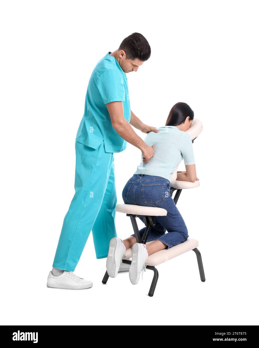 Woman receiving massage in modern chair on white background Stock Photo ...
