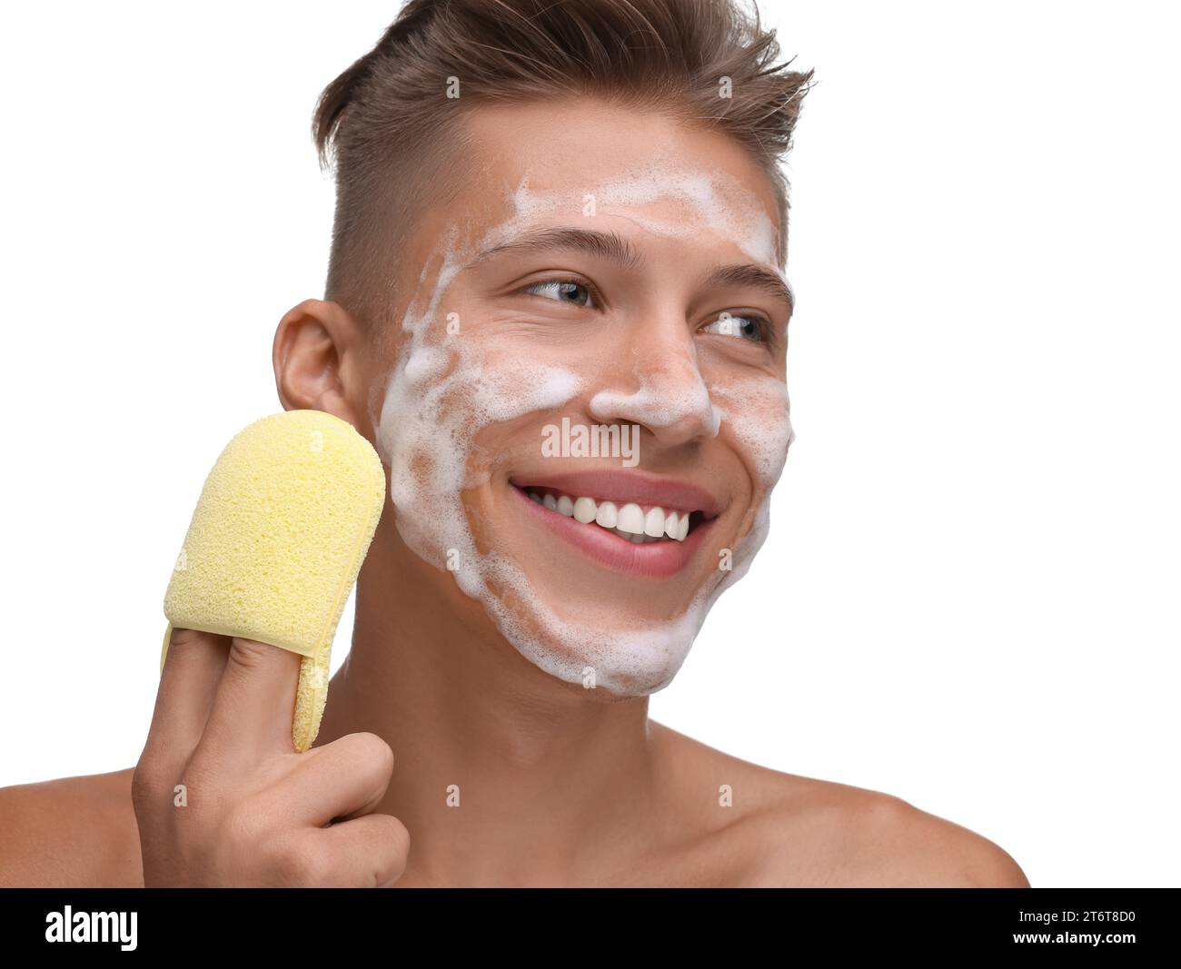 Happy young man washing his face with sponge on white background Stock Photo - Alamy