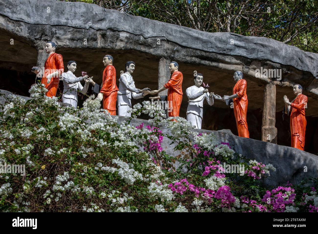 A section of the Golden Temple depicting Buddhist monk statues ...