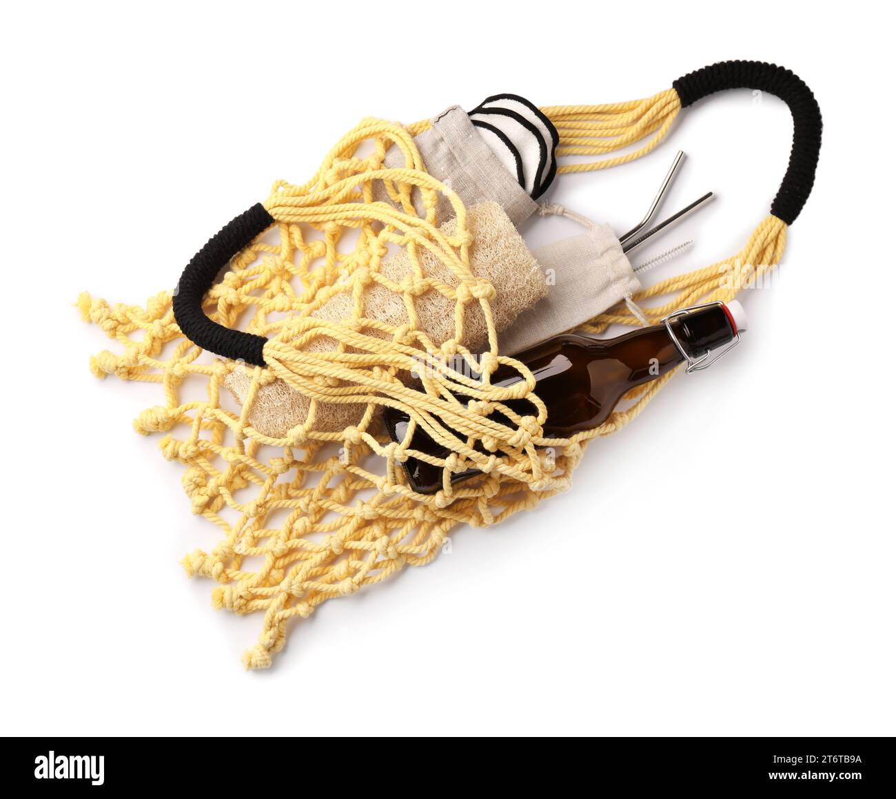 Fishnet bag with different items isolated on white, top view. Conscious ...