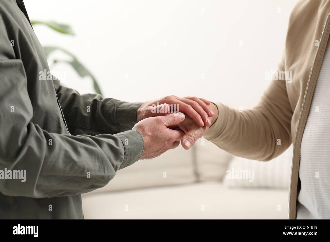 Two people together joining hands hi-res stock photography and images ...