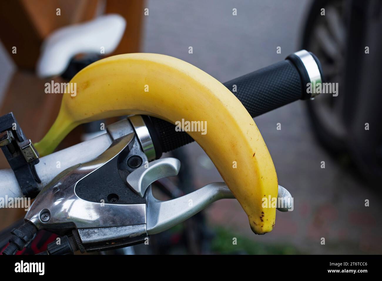 ripe yellow banana on the handlebars of a bicycle. Workout and proper ...