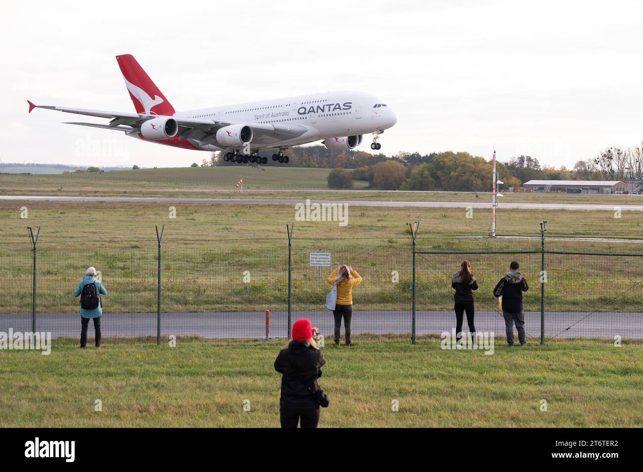 12 November 2023, Saxony, Dresden: Onlookers watch a Qantas Airways ...