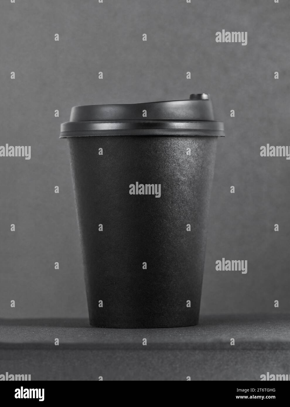 Takeaway coffee cup on black table and dark background Stock Photo - Alamy