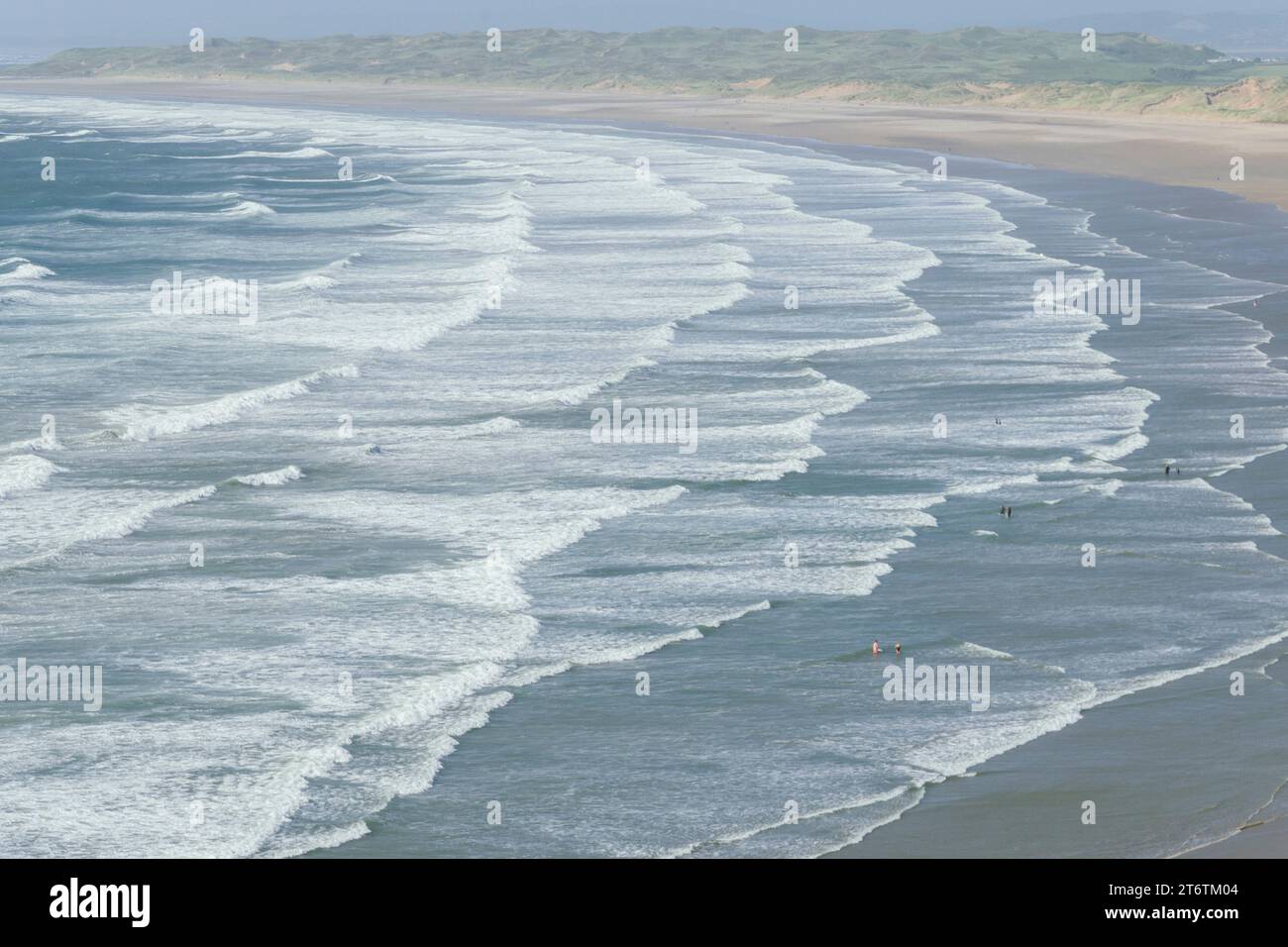 Sets of waves coming in on the beach at Rhosili on the Gower Peninsula ...