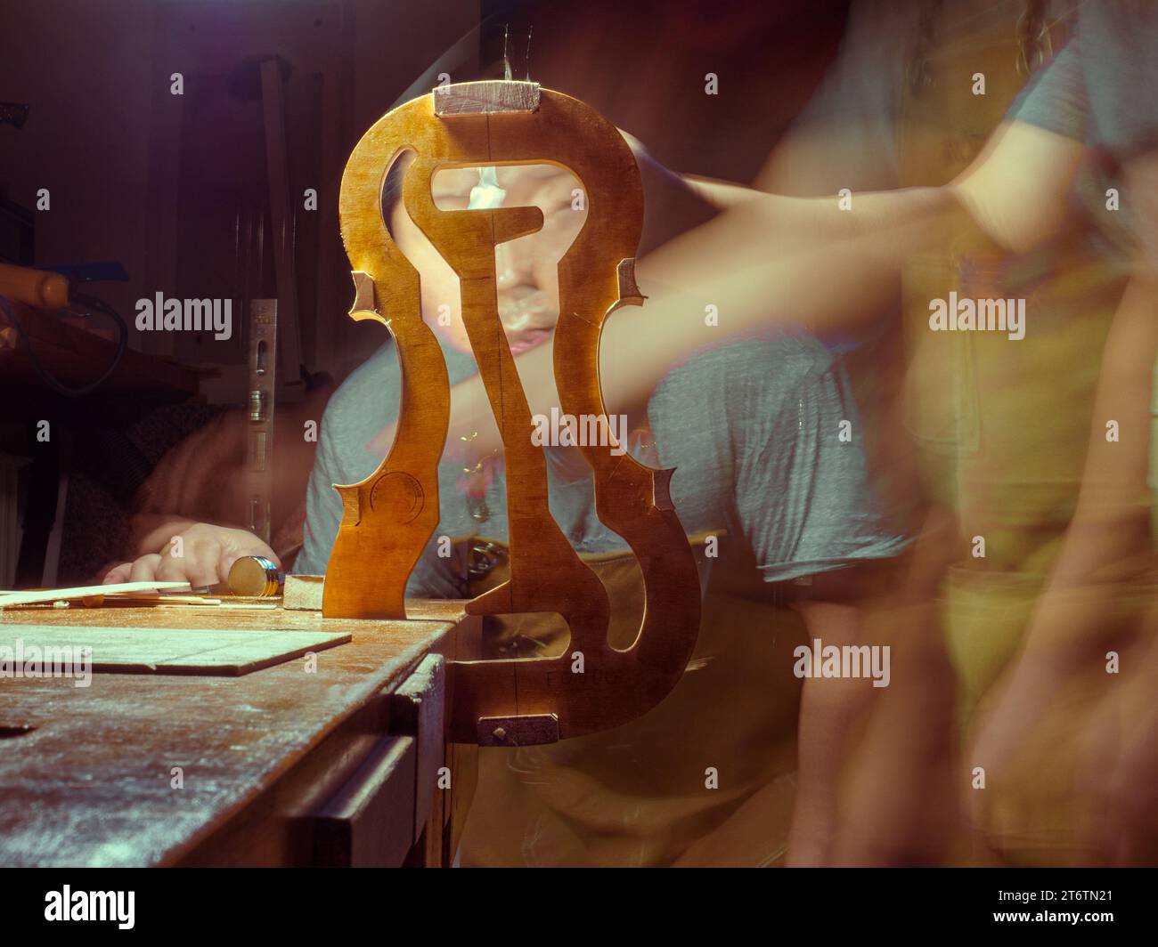 luthier violin maker luthier working with violin mould on center bot ...