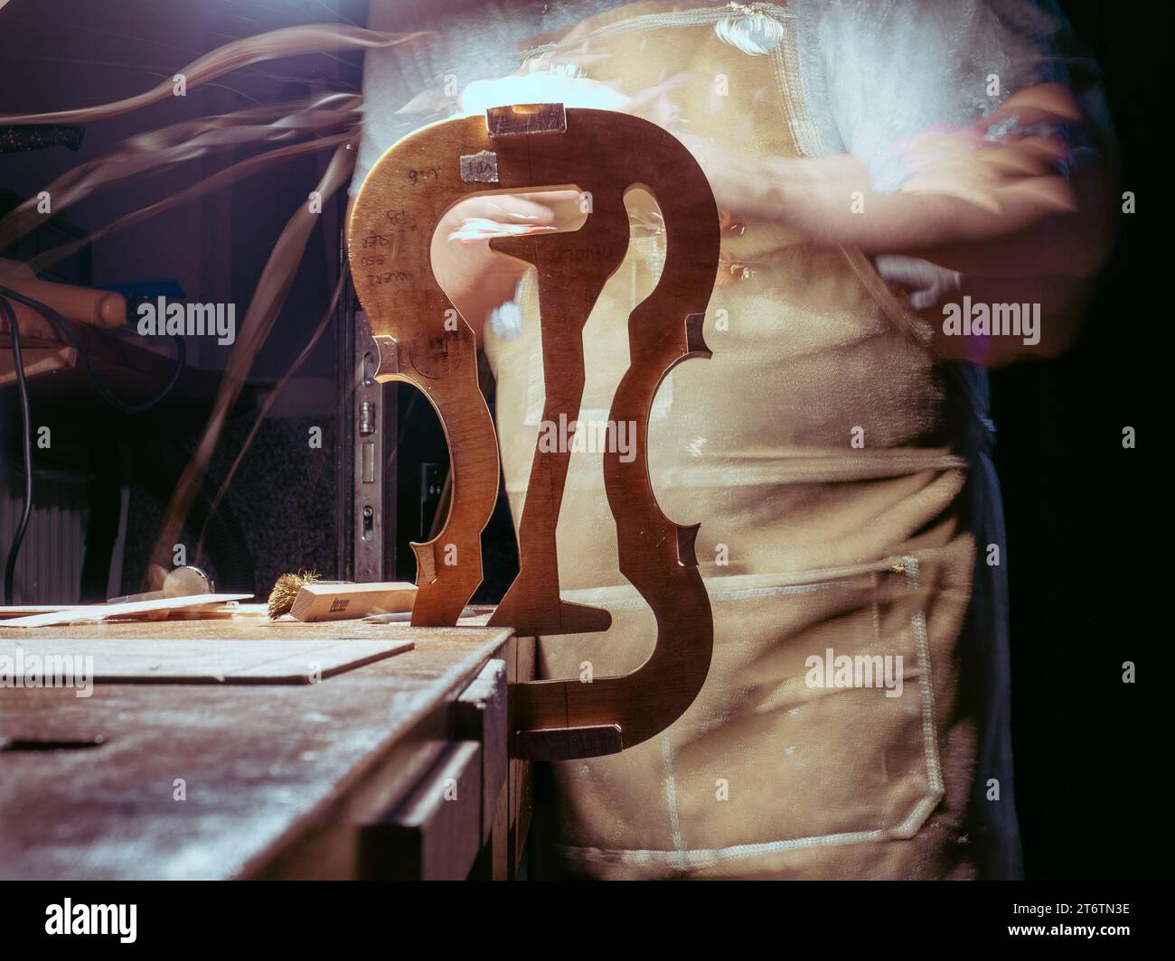 luthier violin maker luthier working with violin mould on center bot ...