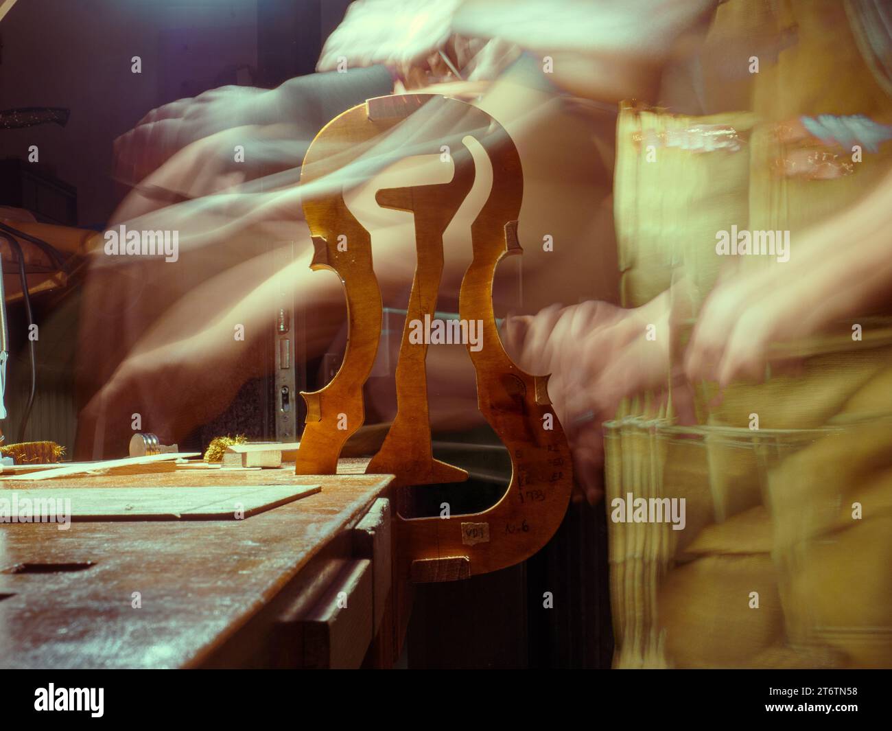 luthier violin maker luthier working with violin mould on center bot ...