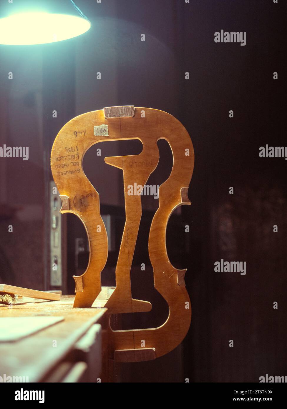 luthier violin maker luthier working with violin mould on center bot ...