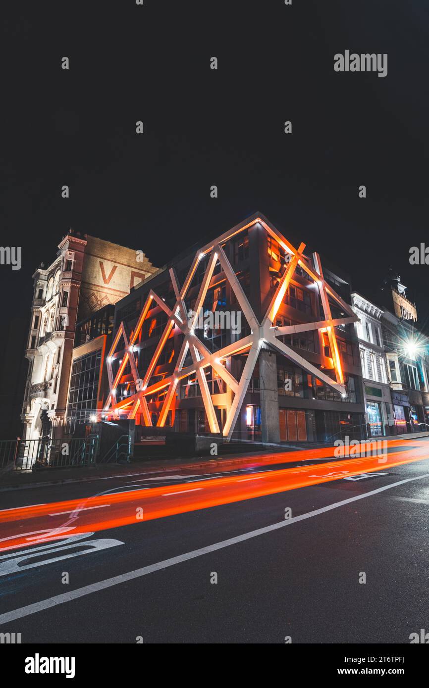 Modern architecture of Ghent during a dark night. Building illuminated ...