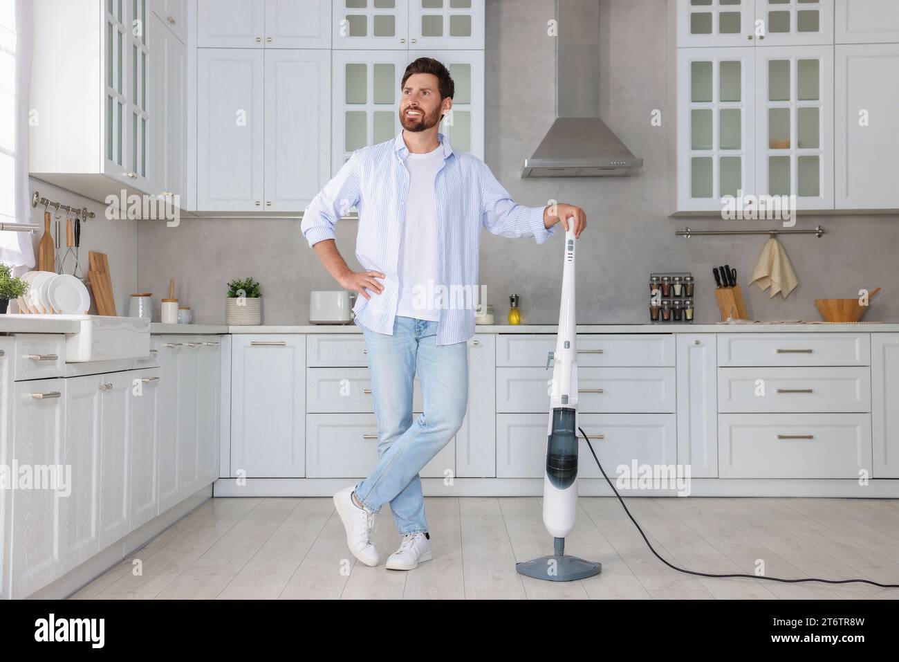 Man mop in kitchen hi-res stock photography and images - Alamy