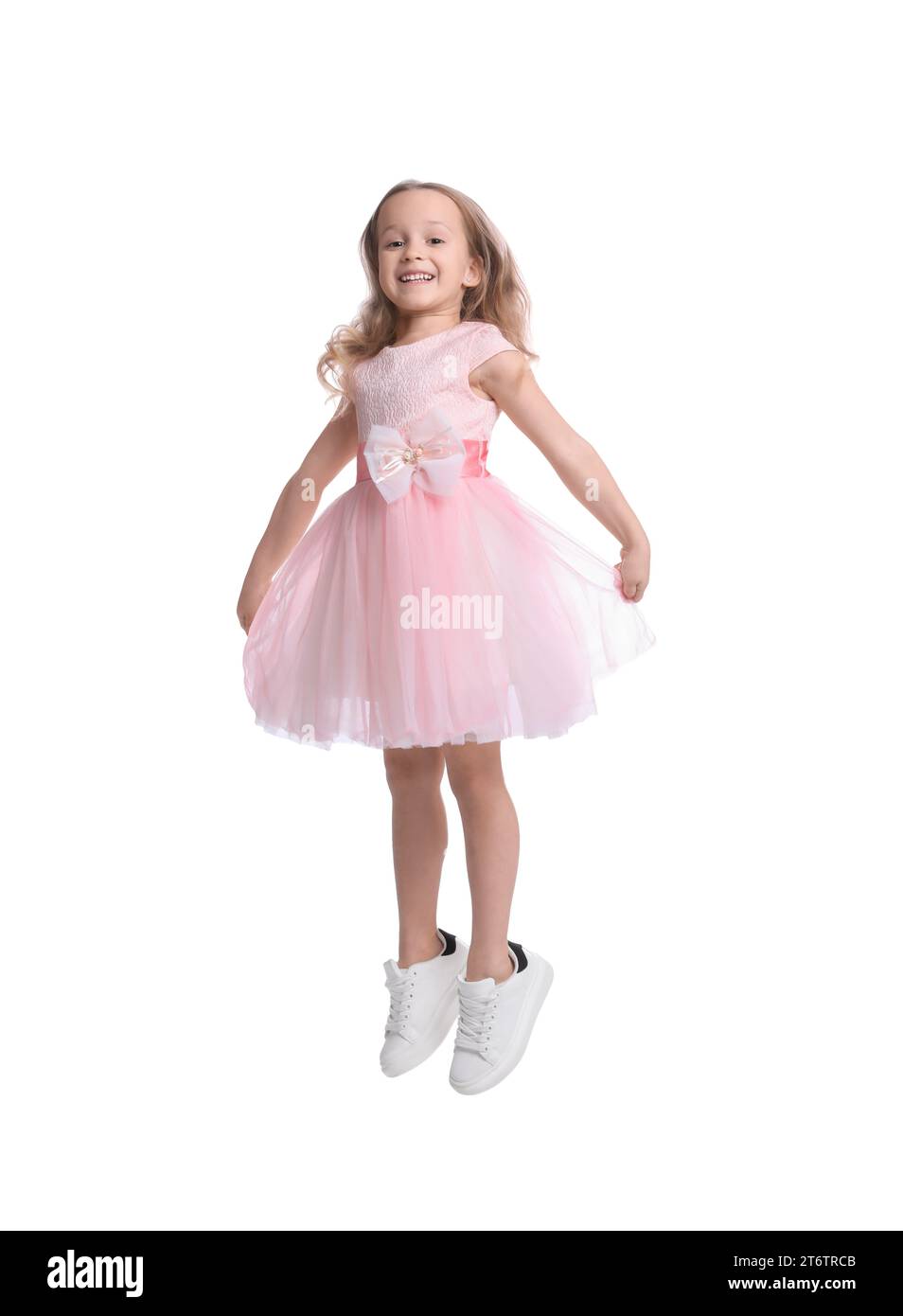Cute little dancer in beautiful dress jumping on white background Stock ...