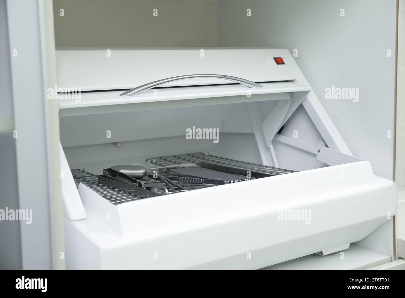 Sterile storage chamber with medical instruments in clinic ...