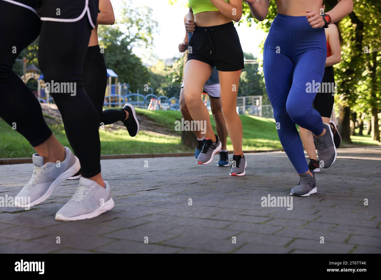 Group of people running in park, closeup Stock Photo - Alamy