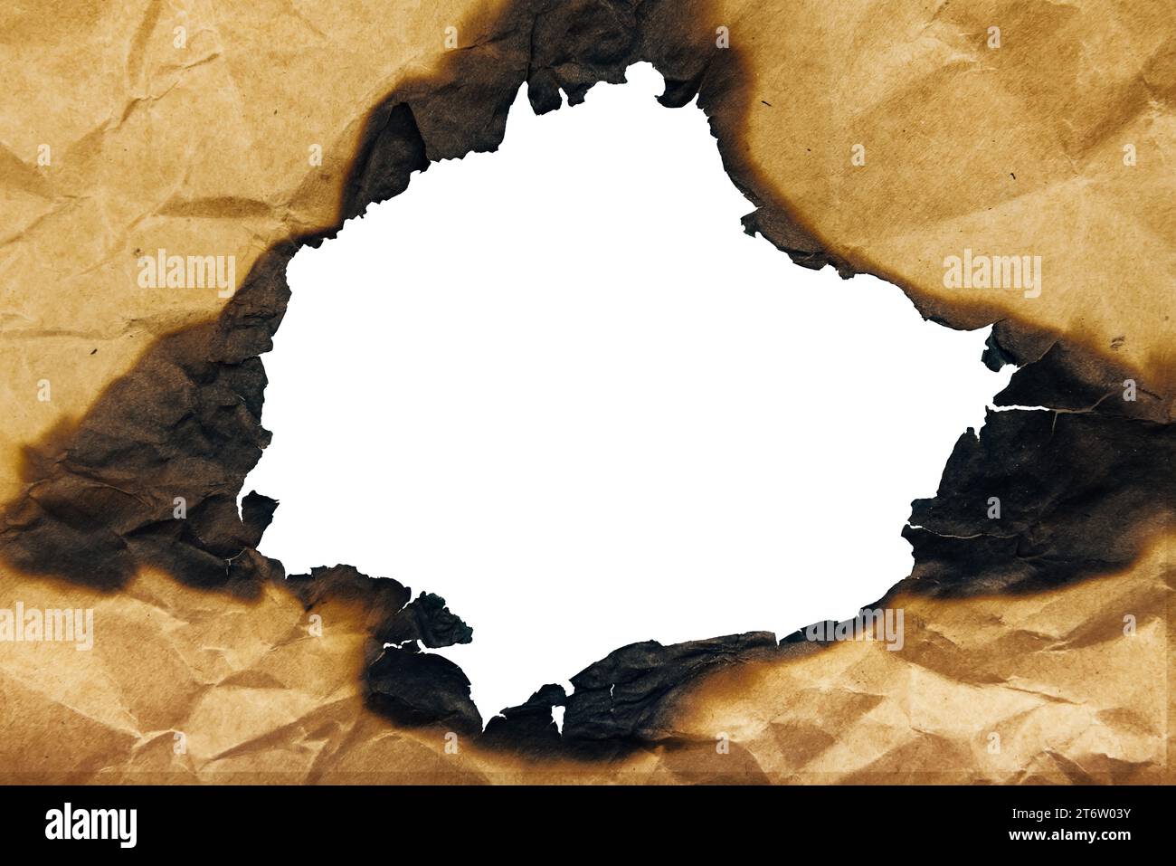Burnt hole in yellow paper. Burnt paper Stock Photo - Alamy
