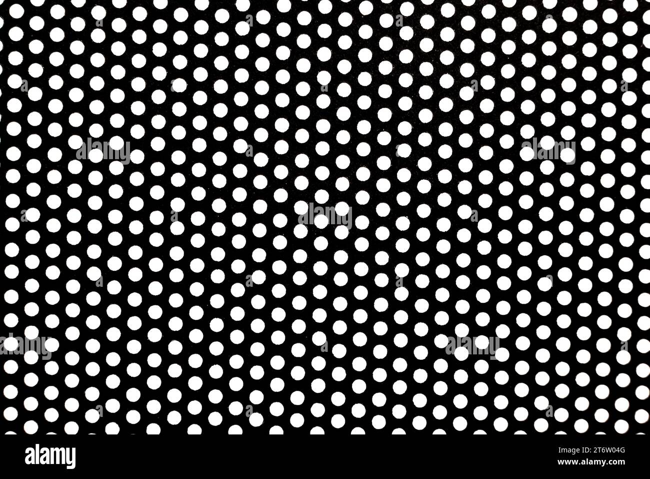Texture of metal black mesh with round holes on a white background ...