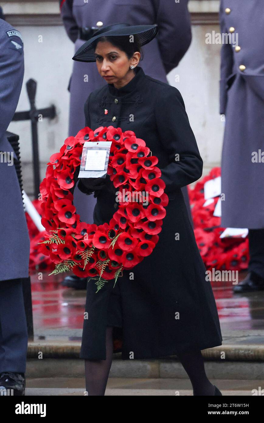 British Home Secretary Suella Braverman holds a wreath as she attends ...