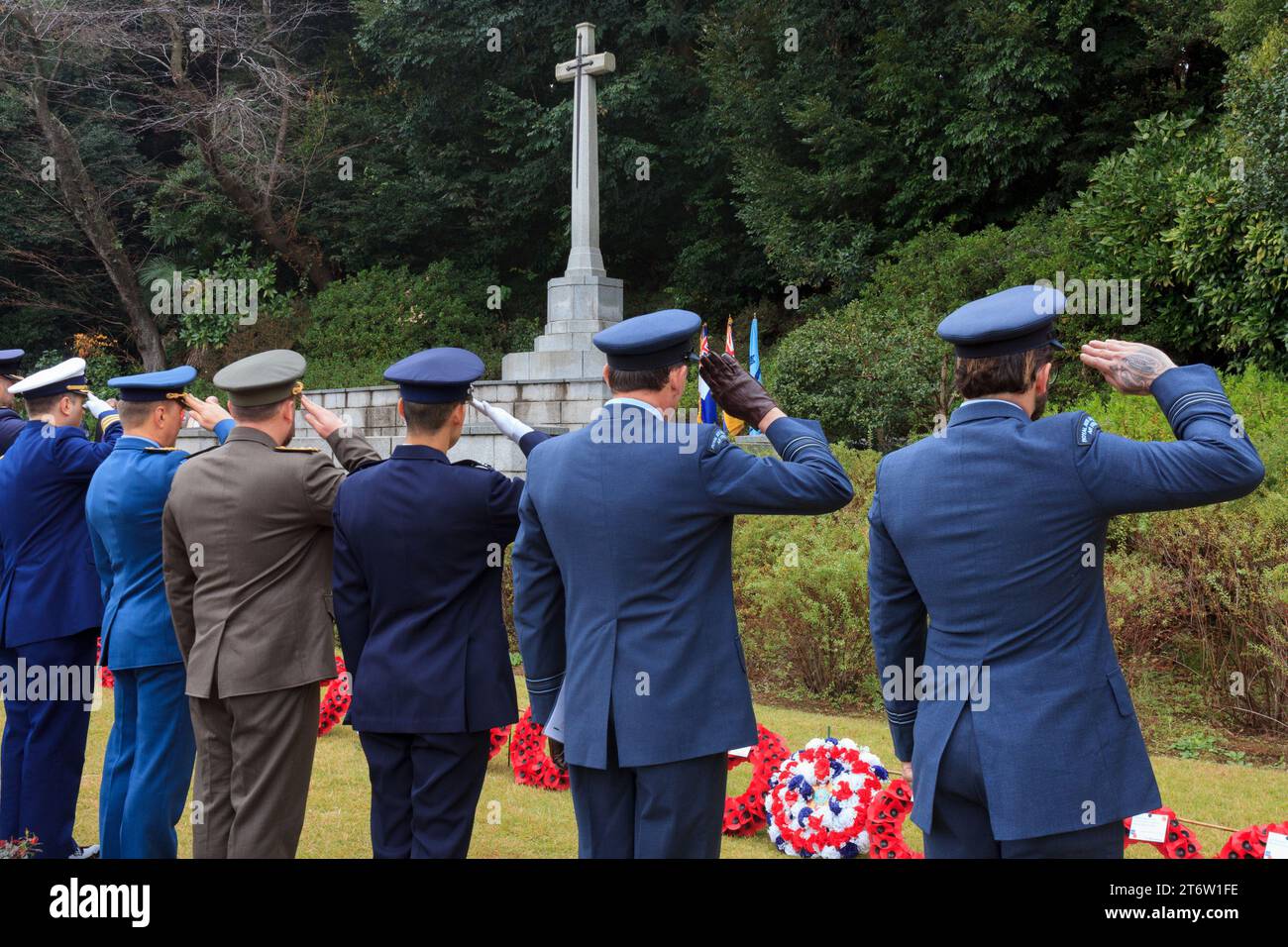 Military personnel salute the Cross of sacrifice during the Remembrance ...