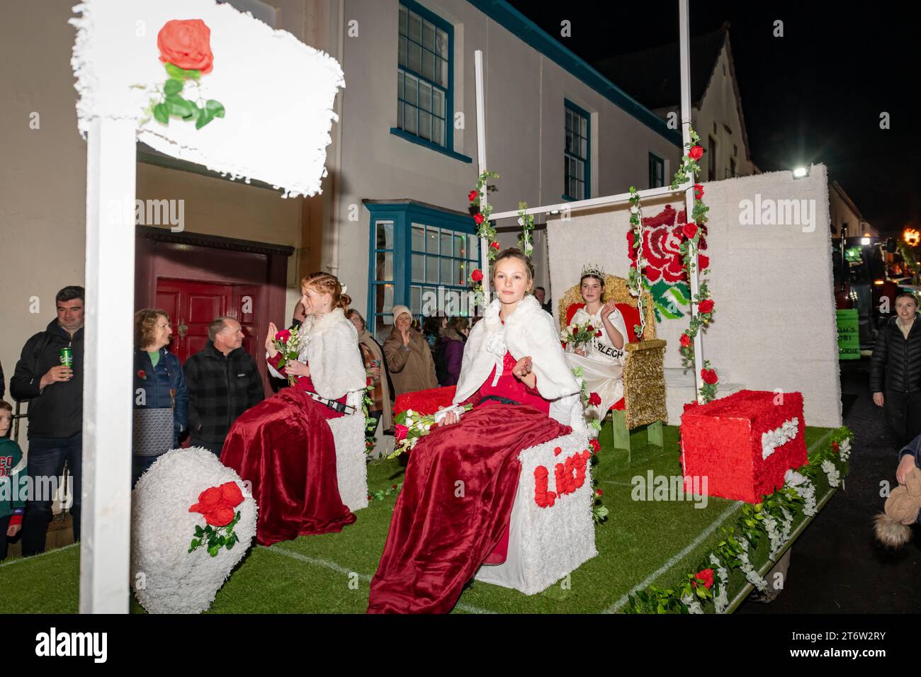 Hatherleigh, UK. , . Colourful parade floats in the Hatherleigh Carnival & Tar Barrels at night ...
