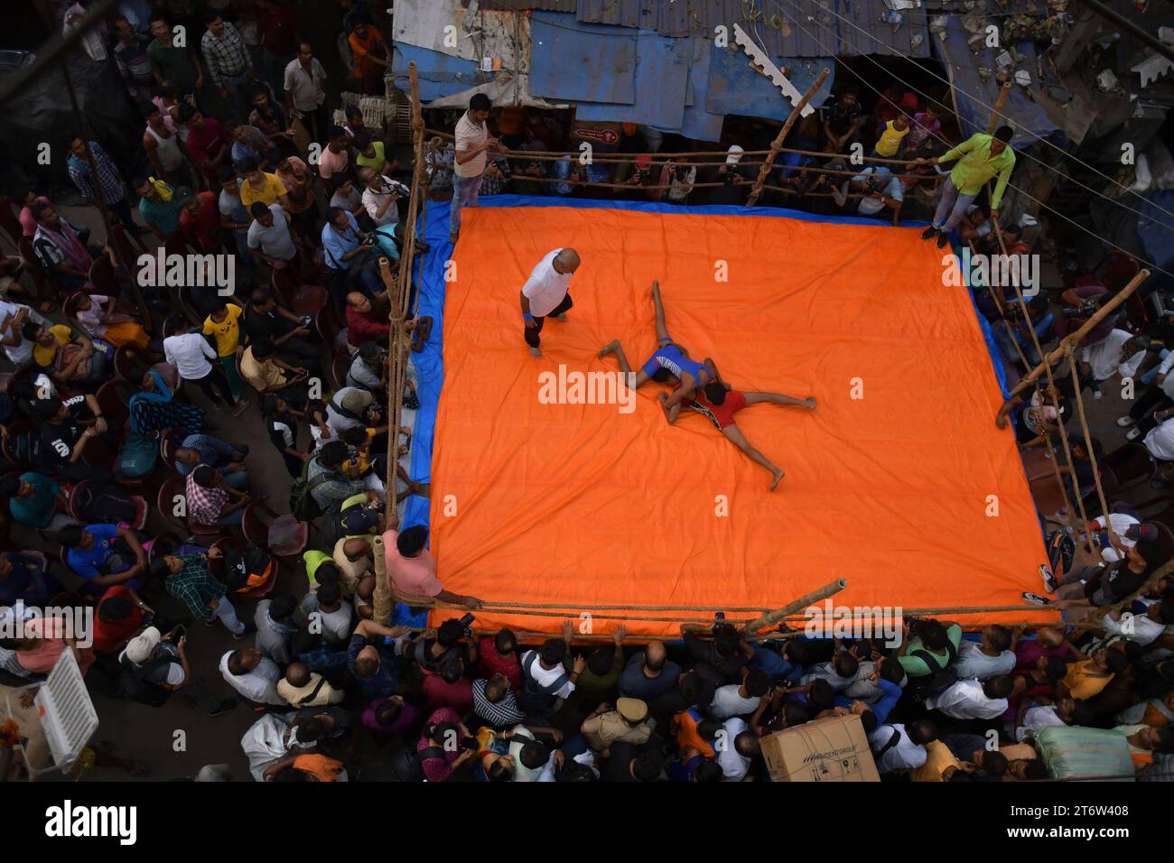 A top view while Wrestlers participate in an open-air street wrestling ...