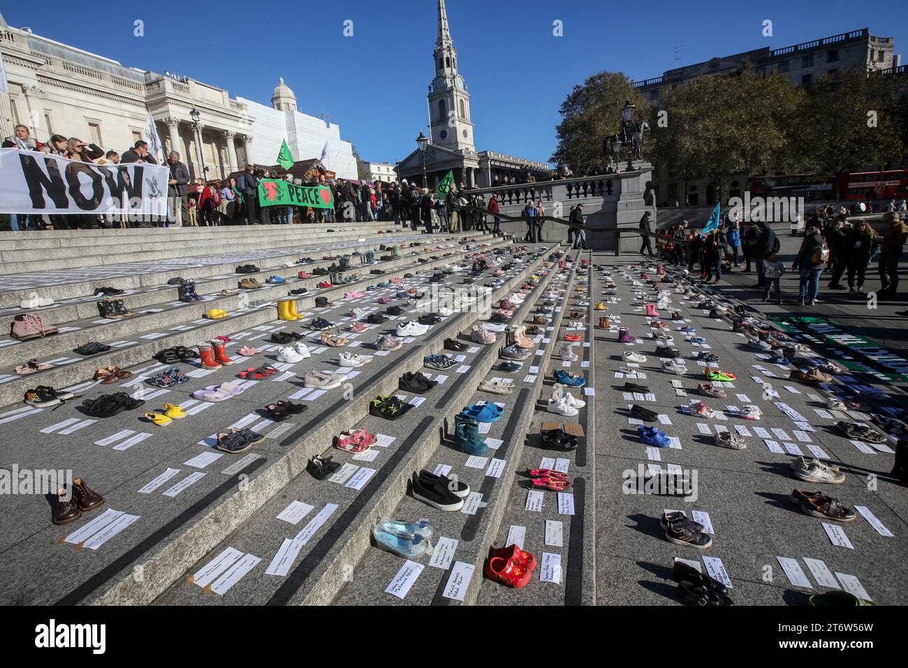 Pairs of shoes sit on the steps below the National Gallery, beside ...