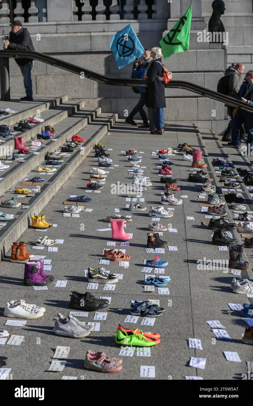 Pairs of shoes sit on the steps below the National Gallery, beside ...