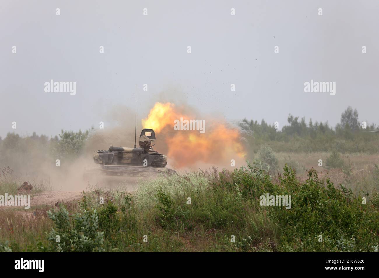 Fire and smoke from a tank shot during training at the training ground ...