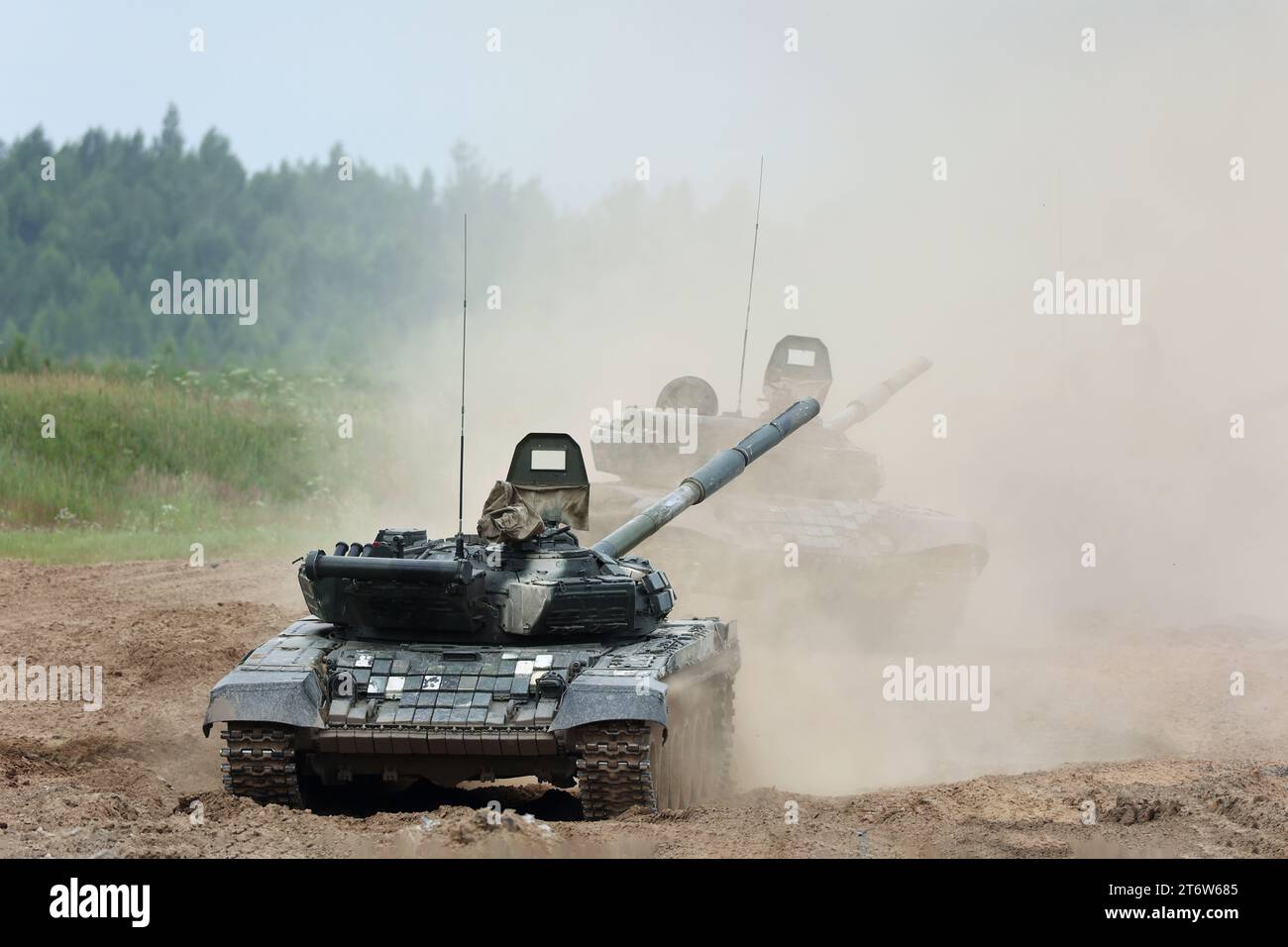 Powerful heavy fighting vehicle tank rides through the range during ...