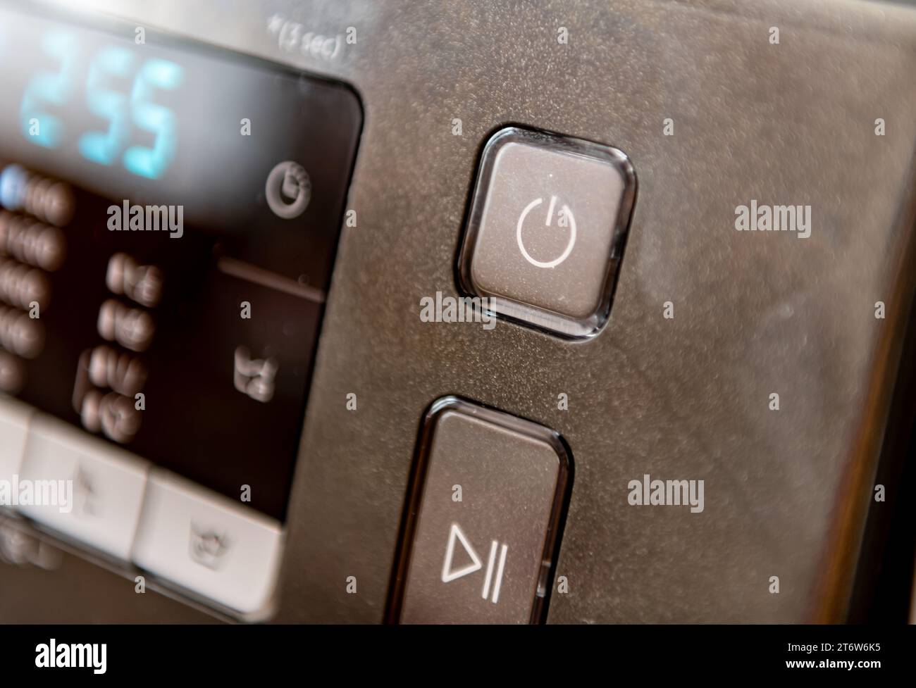 The power on and start button on a domestic appliance Stock Photo - Alamy