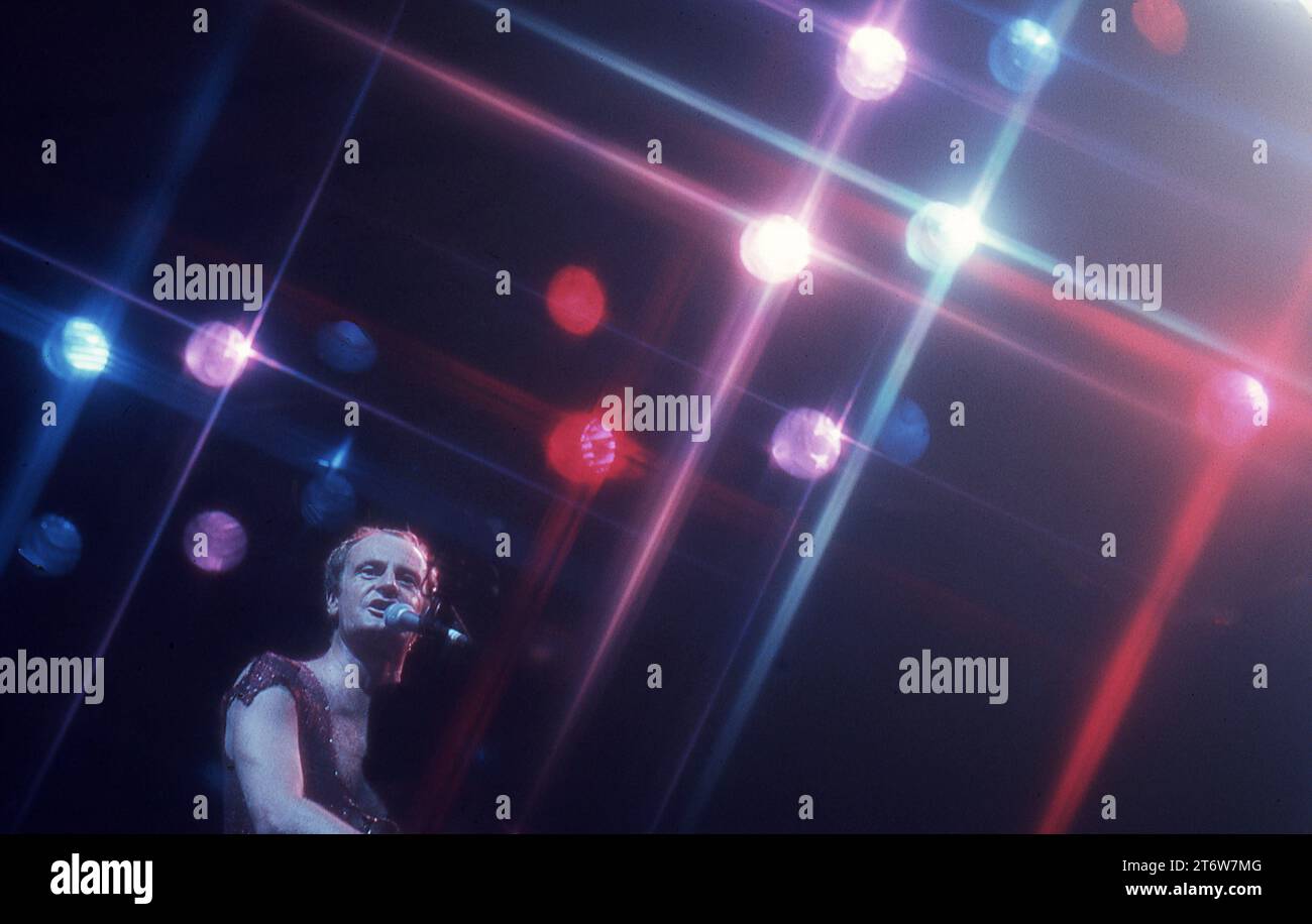 Singer, songwriter and performer Peter Allen on stage in Central Park ...