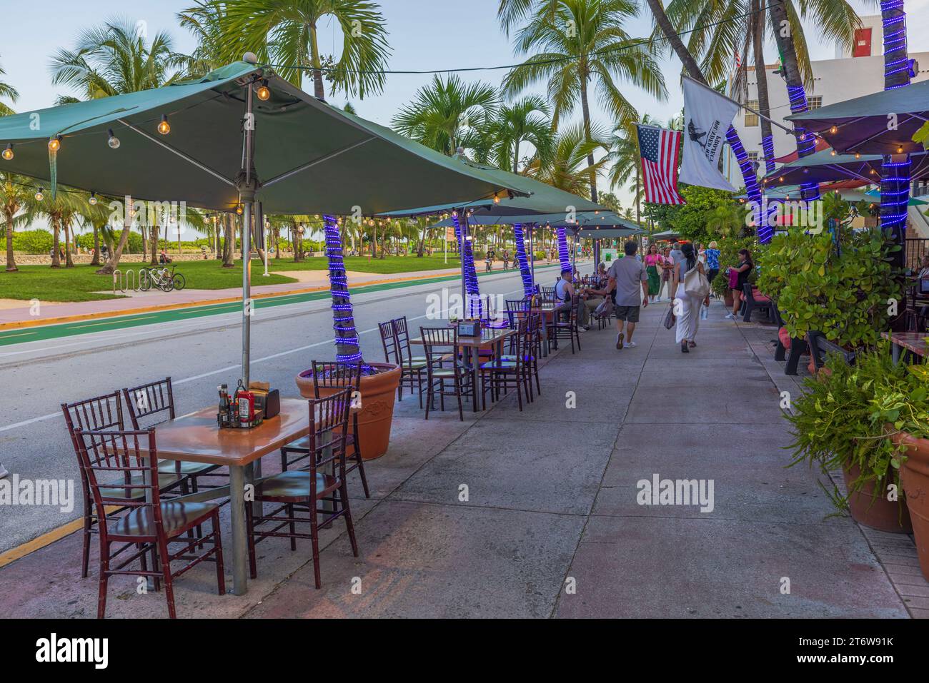 View of street-side restaurant scene on Ocean Drive in Miami Beach. USA ...
