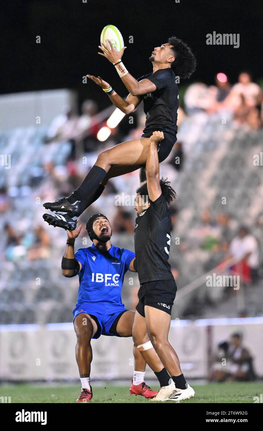 Codemeru Vai (top) of New Zealand is lifted by team mate Fehi Fineanganofo (bottom) to catch the ...