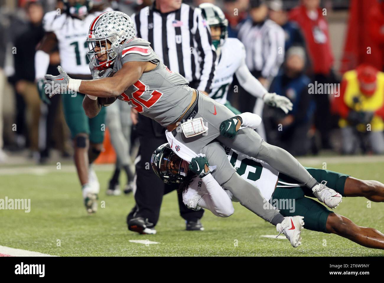 Ohio State Buckeyes TreVeyon Henderson (32) dives into the endzone for ...