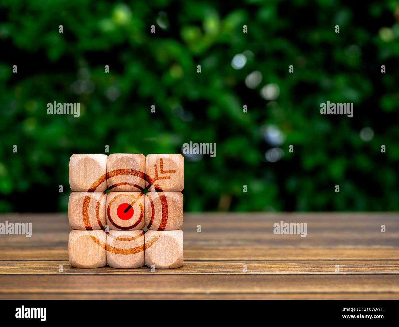 Building success goal business. Big target icon on wooden cube blocks ...