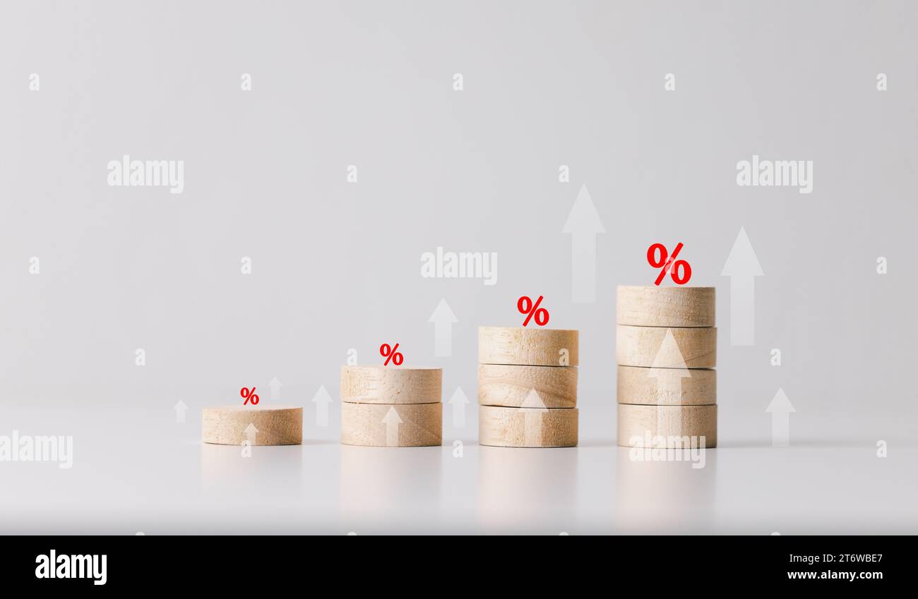 Up arrow growth on wooden cube blocks, bar graph chart steps with ...