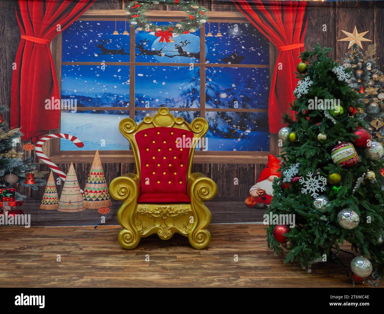 Santa Claus golden chair next to window Stock Photo - Alamy